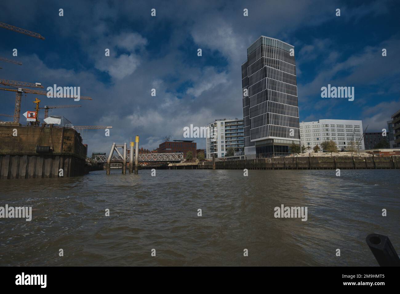 A tall building near the harbor Stock Photo - Alamy