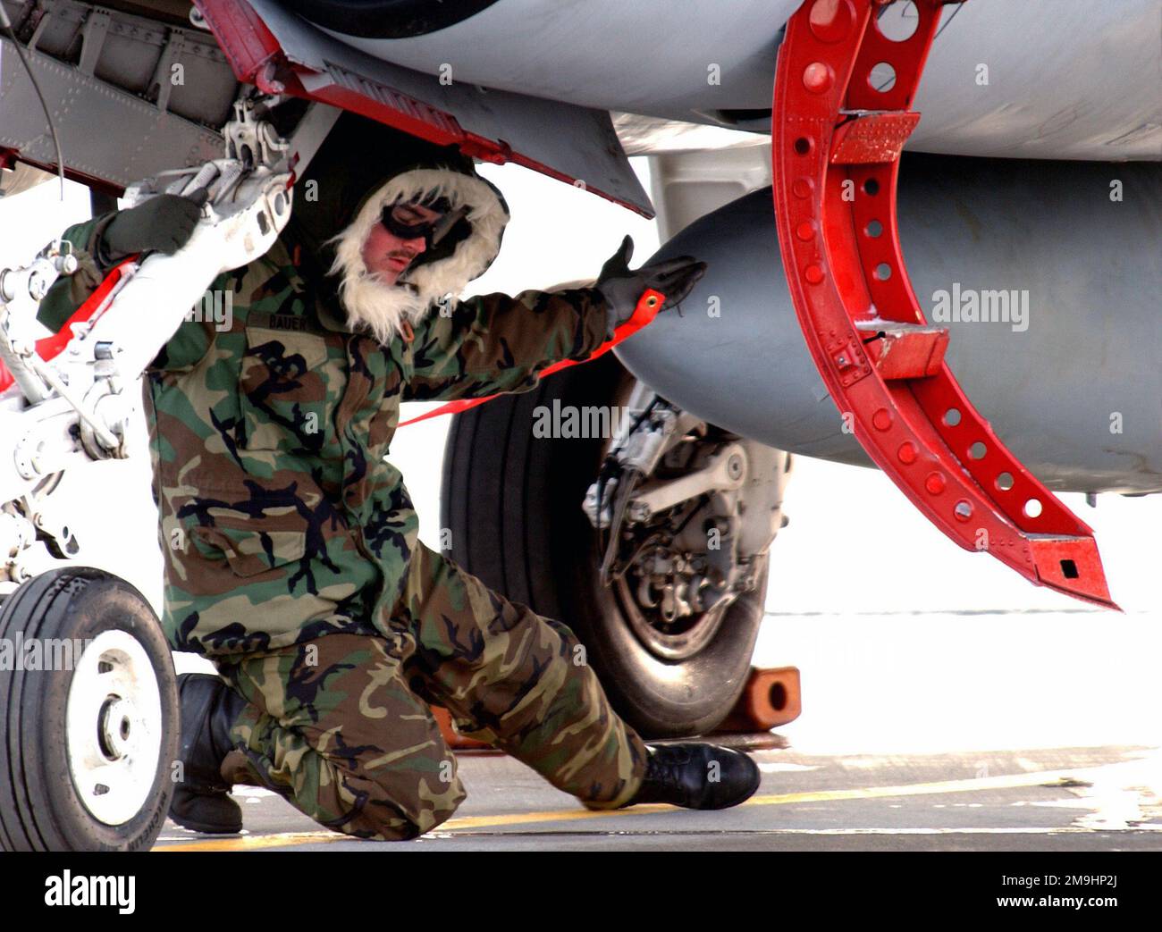 US Navy (USN) plane captain prepares an EA-6B Prowler with the ...