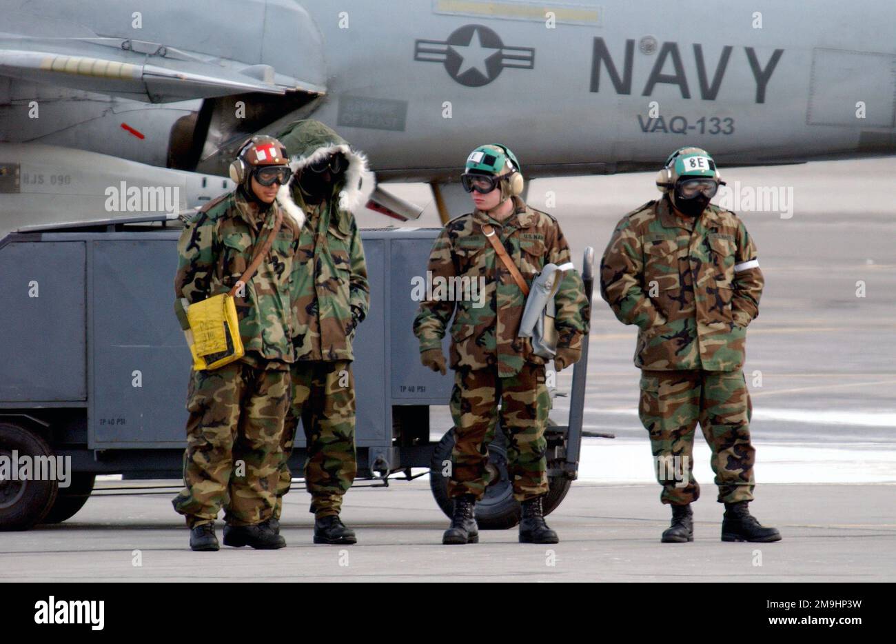 US Navy (USN) plane captains standby as coworkers prepare EA-6B ...