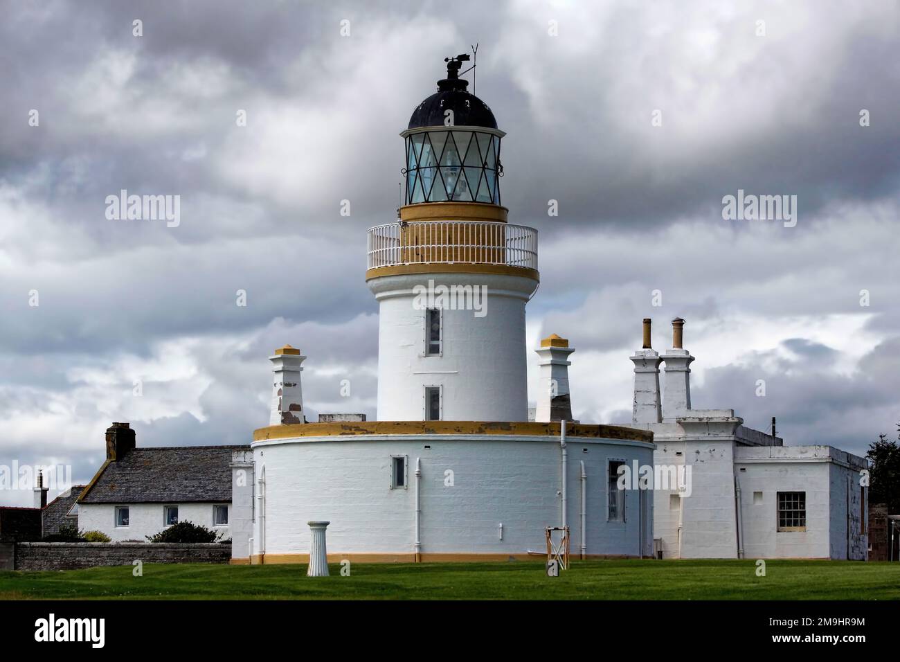 Chanonry Point Lighthouse closeup under a cloudy sky Stock Photo - Alamy