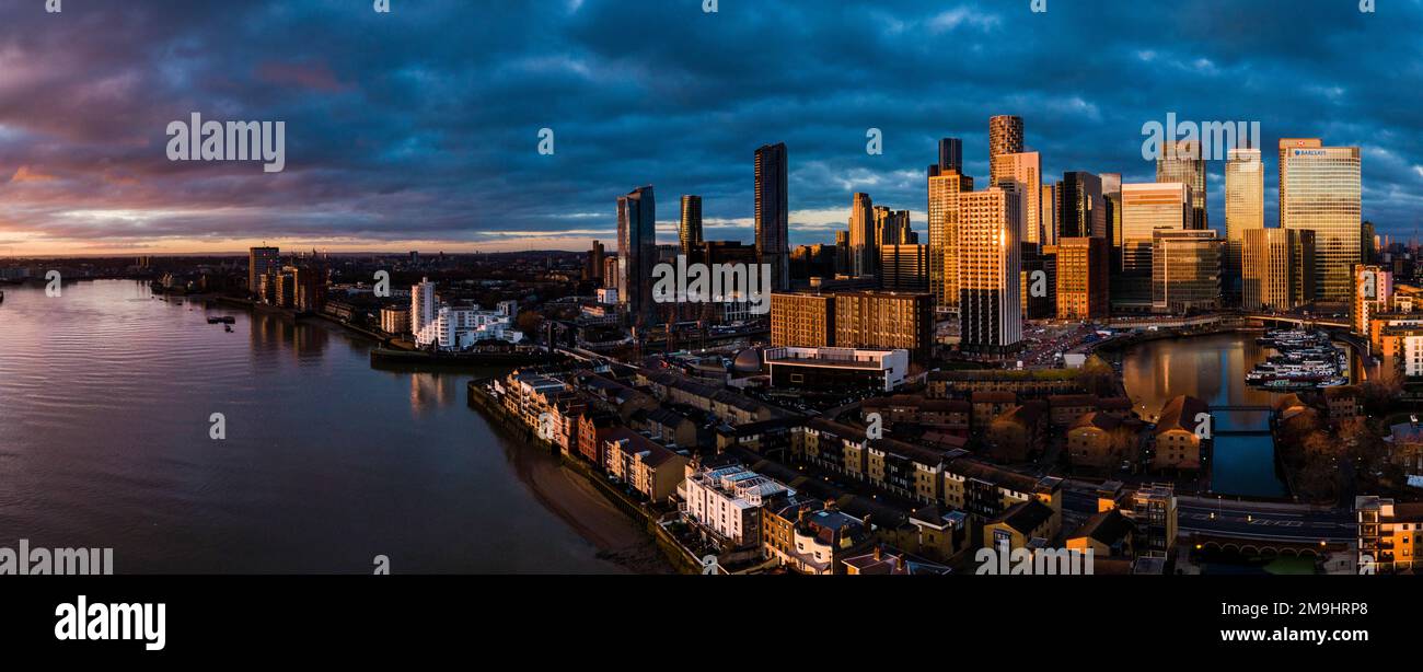 Aerial view of Canary Wharf and River Thames at sunset, London, England ...