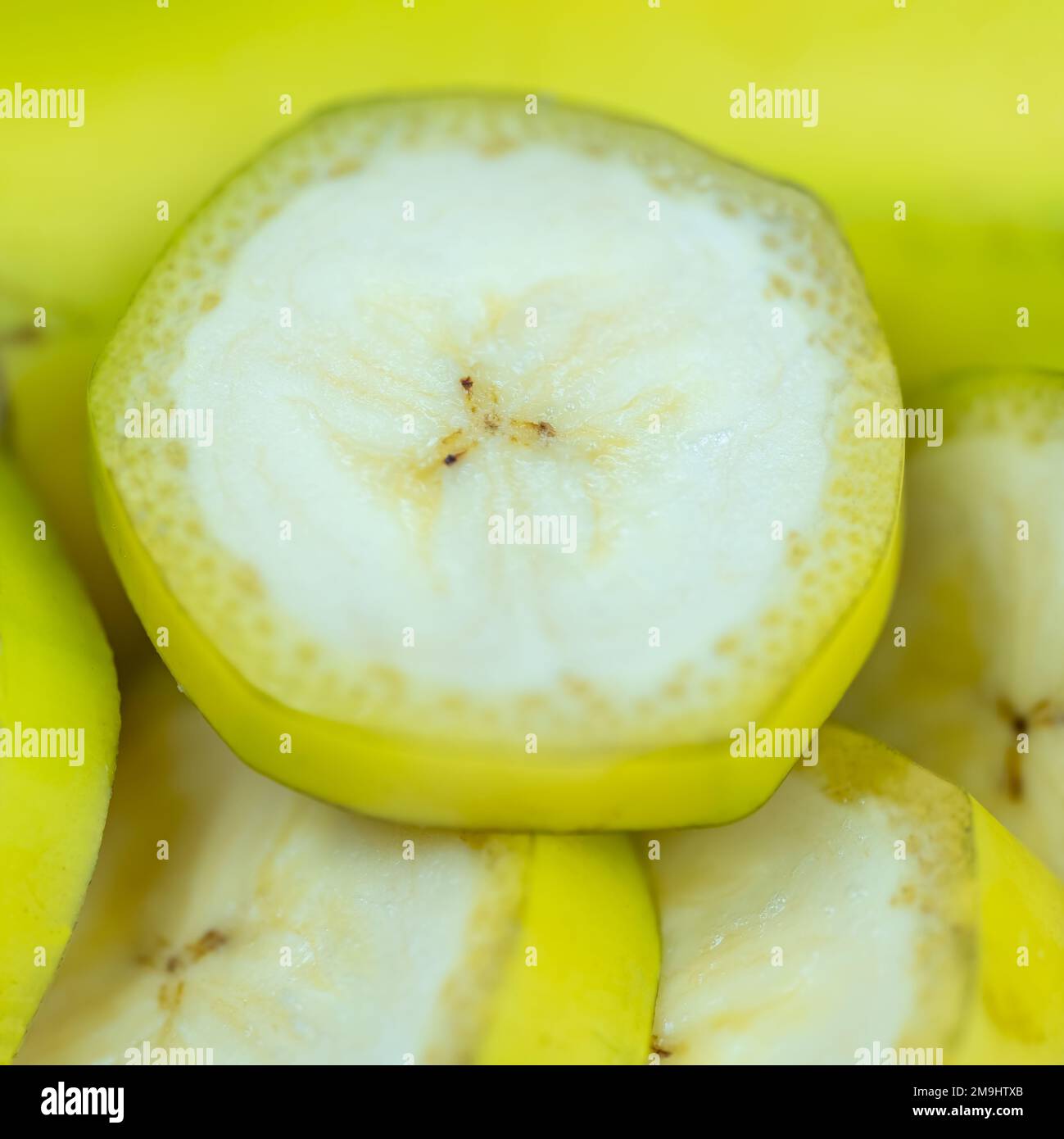 Background of banana slices cut into thin pieces and stacked ...