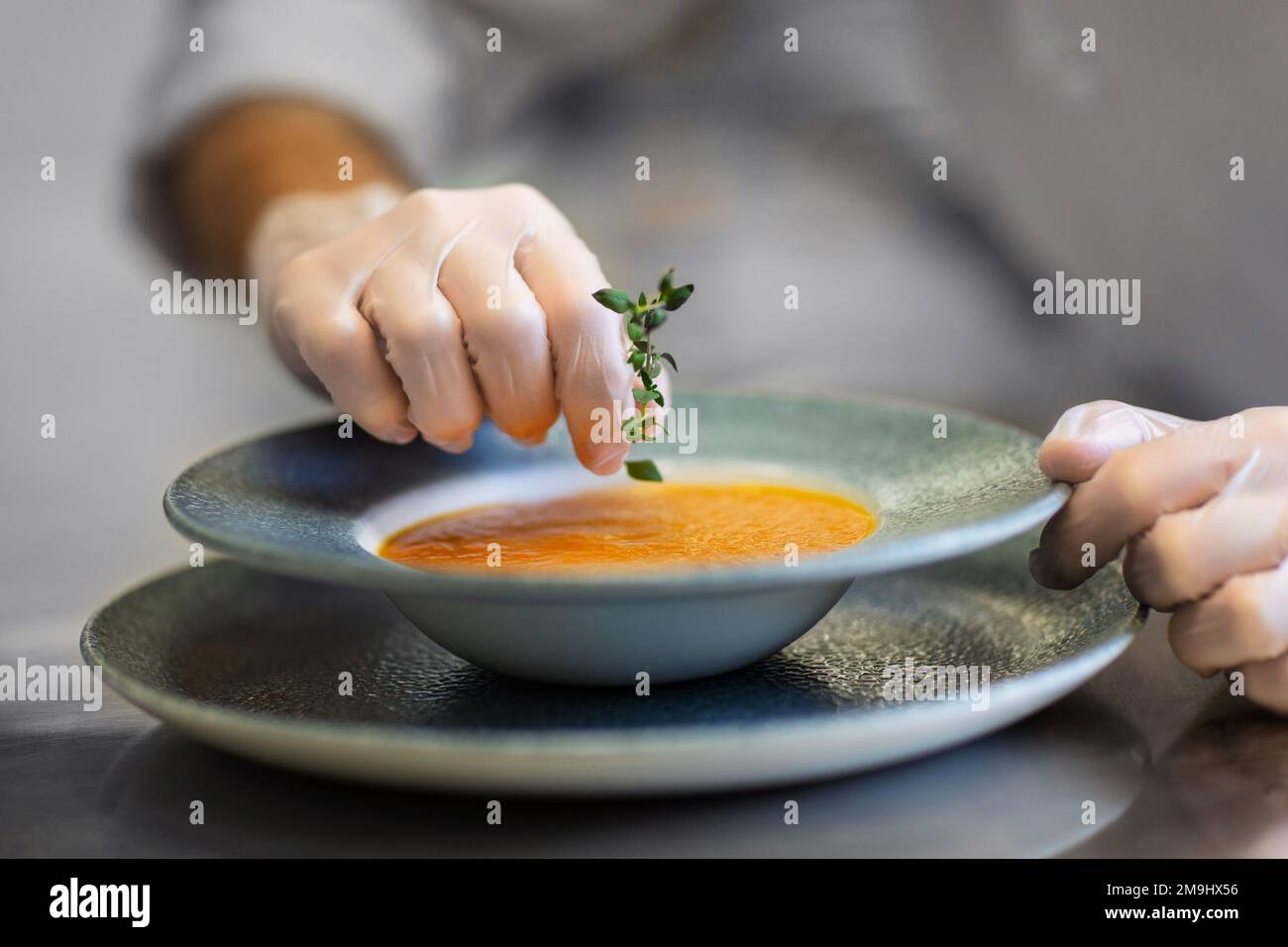 Chef preparing delicious soup hi-res stock photography and images - Alamy