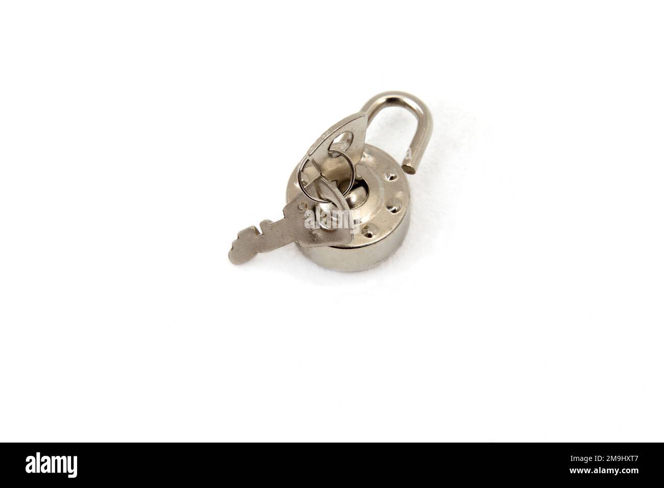 Small metal Circular Padlock and Two Keys Stock Photo - Alamy