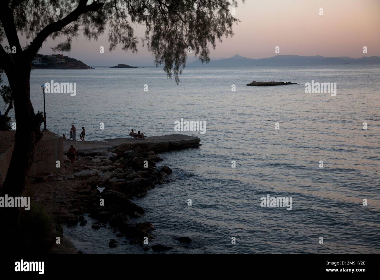 beach at sunset vouliagmeni athens riviera athens greece Stock Photo ...