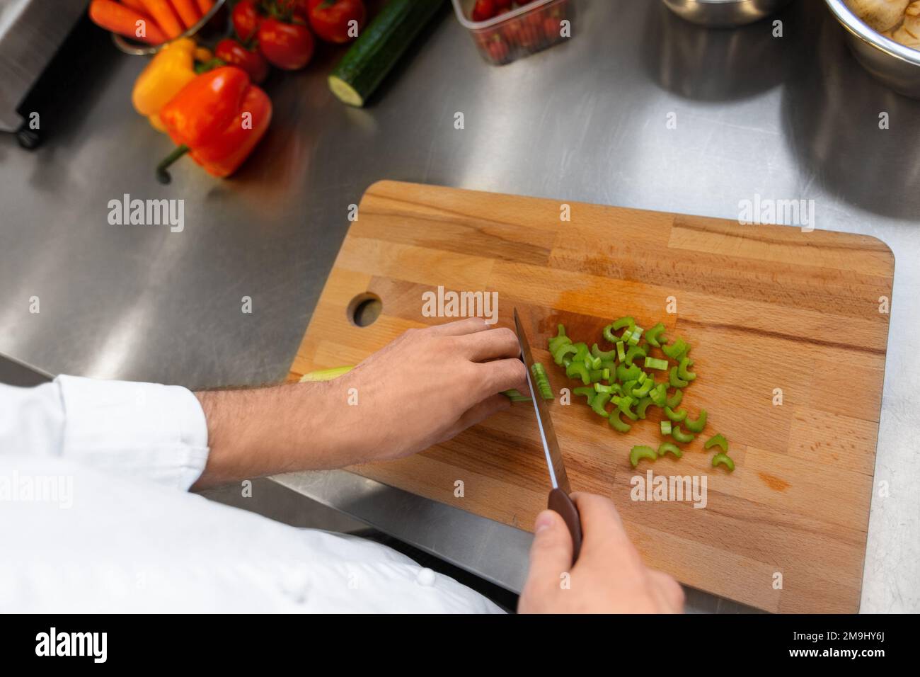 close up of chef cooking food on kitchen Stock Photo - Alamy