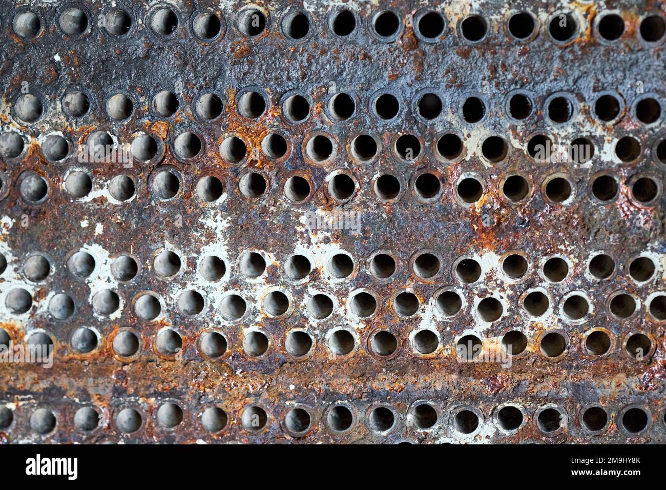 Tube sheet plate of heat exchanger or boiler closeup texture macro ...