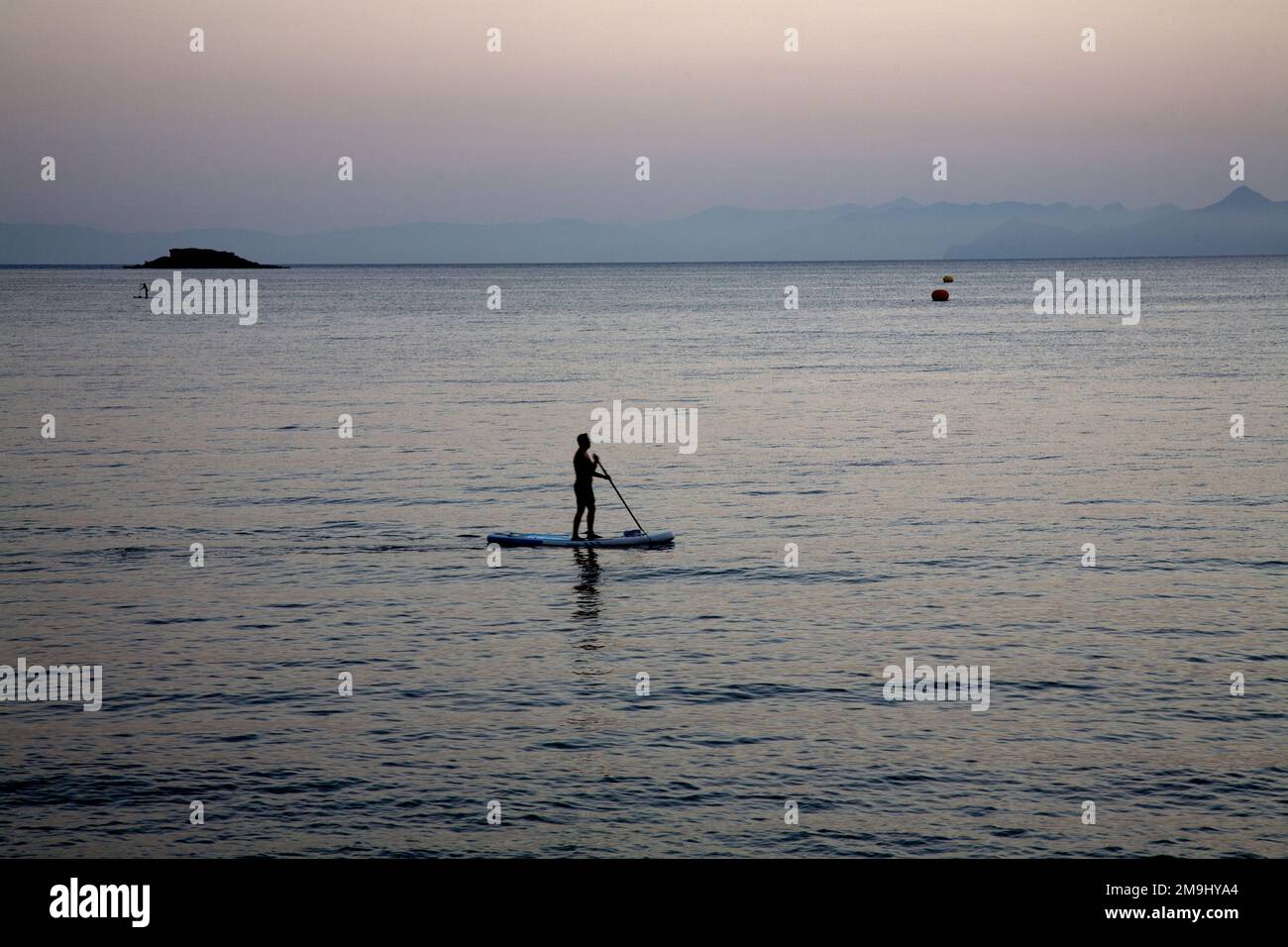 kavouri beach at sunset vouliagmeni athens riviera athens greece Stock ...