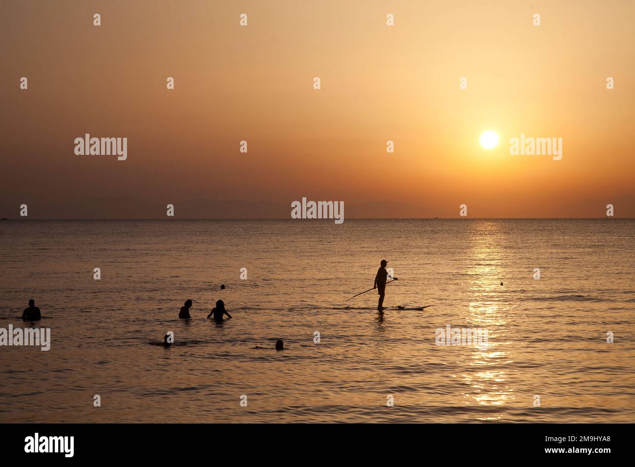 kavouri beach at sunset vouliagmeni athens riviera athens greece Stock ...