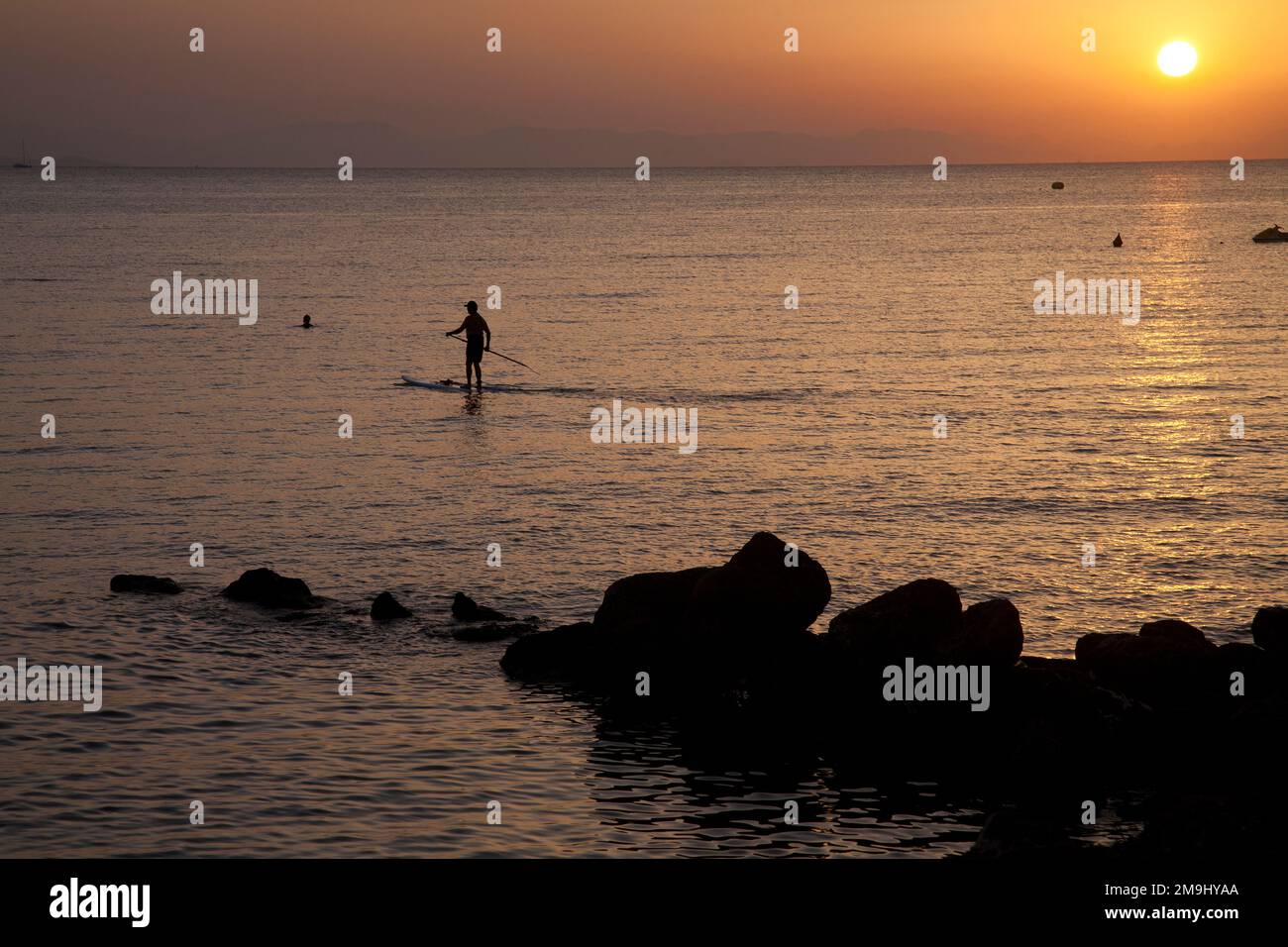 kavouri beach at sunset vouliagmeni athens riviera athens greece Stock ...