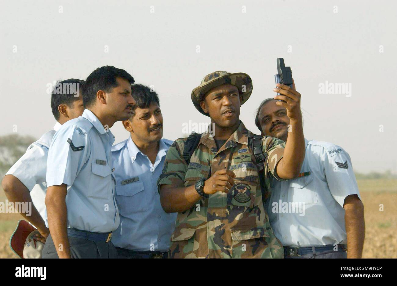 US Air Force (USAF) STAFF Sergeant (SSGT) Tony Yates (center), 353rd ...