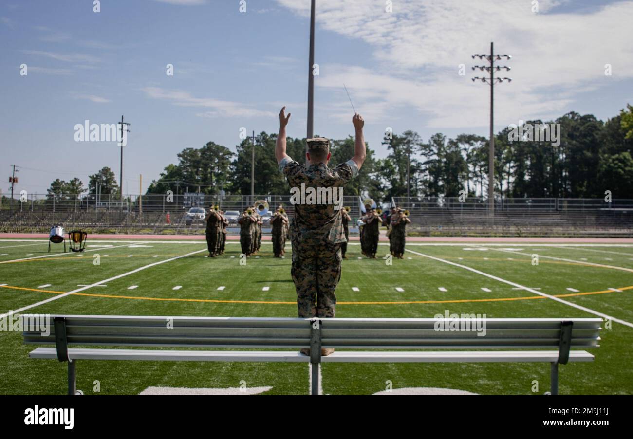Chief Warrant Officer 2 Stephen Howell, the conductor for the 2d Marine Division Band, conducts ...