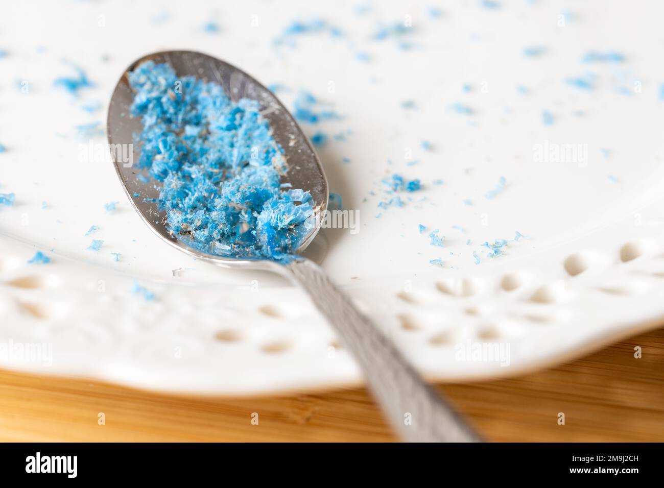 Microplastic in food, Environment and health concept, spoon and plate ...