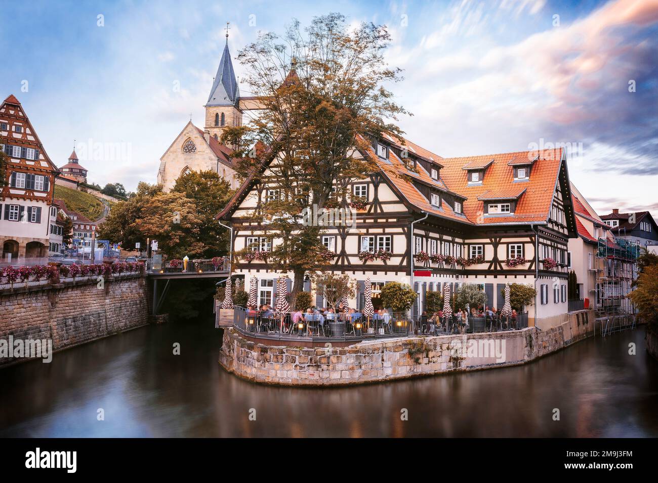 A German old house on the river in the old town of Essligen, Germany ...