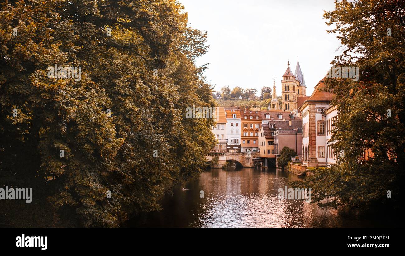 The old town of Essligen surrounded by trees and a river in Germany ...