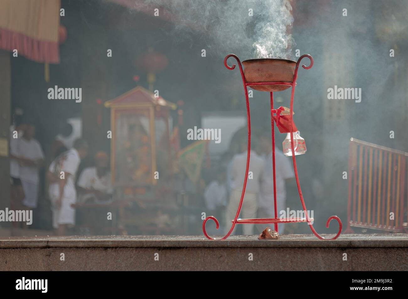 Burning incense, the symbol of paying homage to the Gods and Goddesses ...