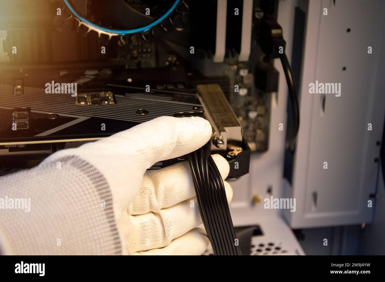 Technician repairing computers, connecting wires to computers Stock ...