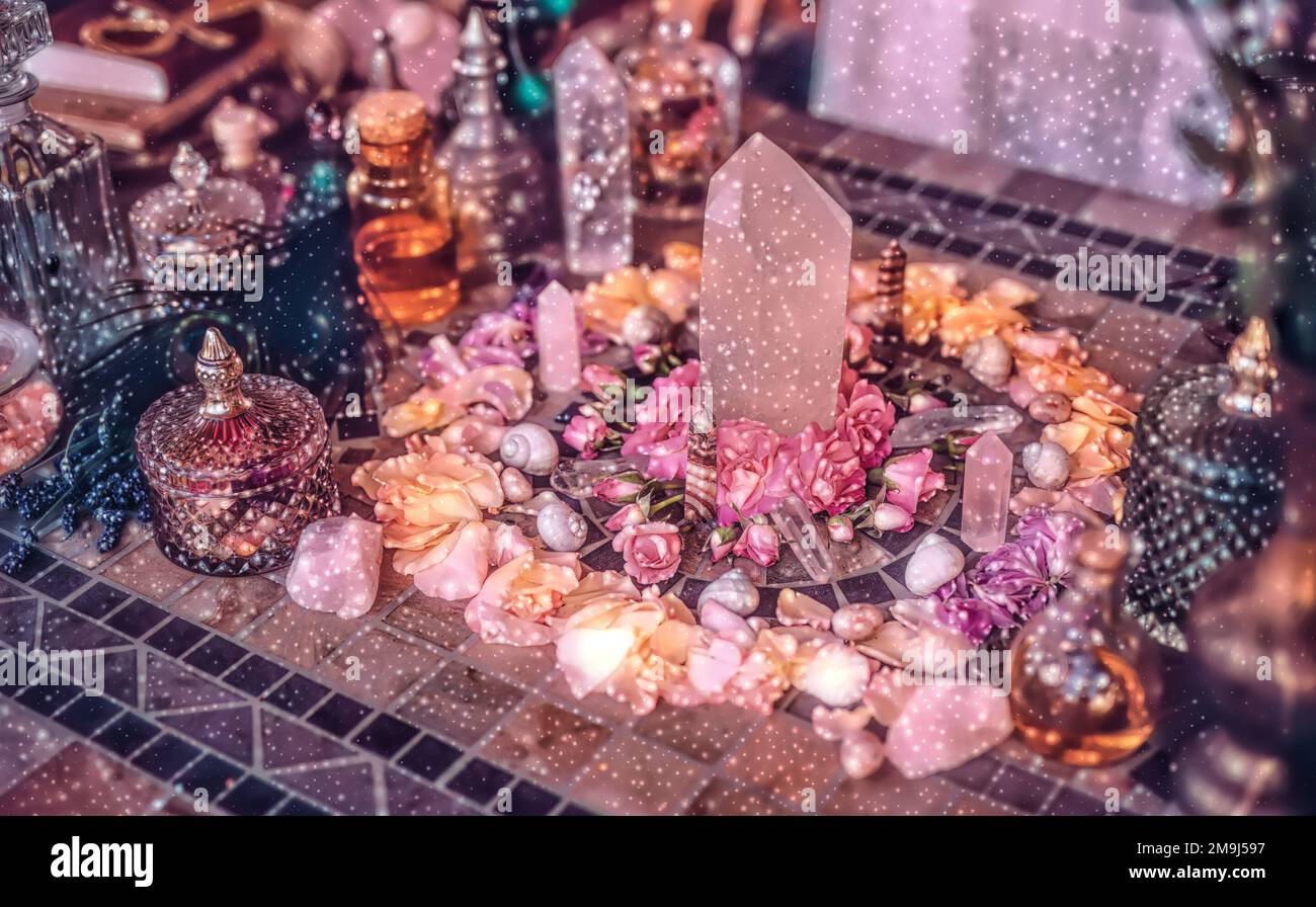 beautiful altar with crystals and rose flowers. magic light effect ...