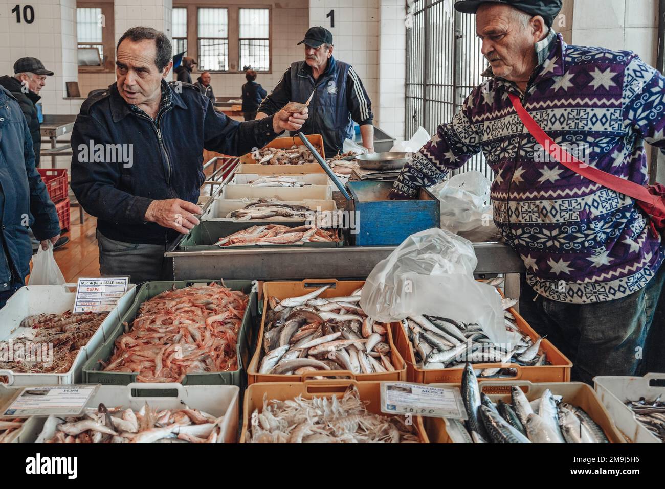 Mola di Bari, Italy - January 2023: local life scene by the fish market ...