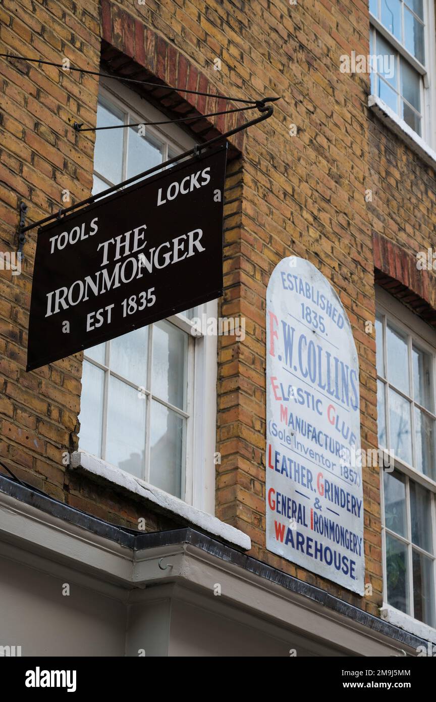 The Ironmonger, signs on wall above shops in Monmouth Street, Seven ...