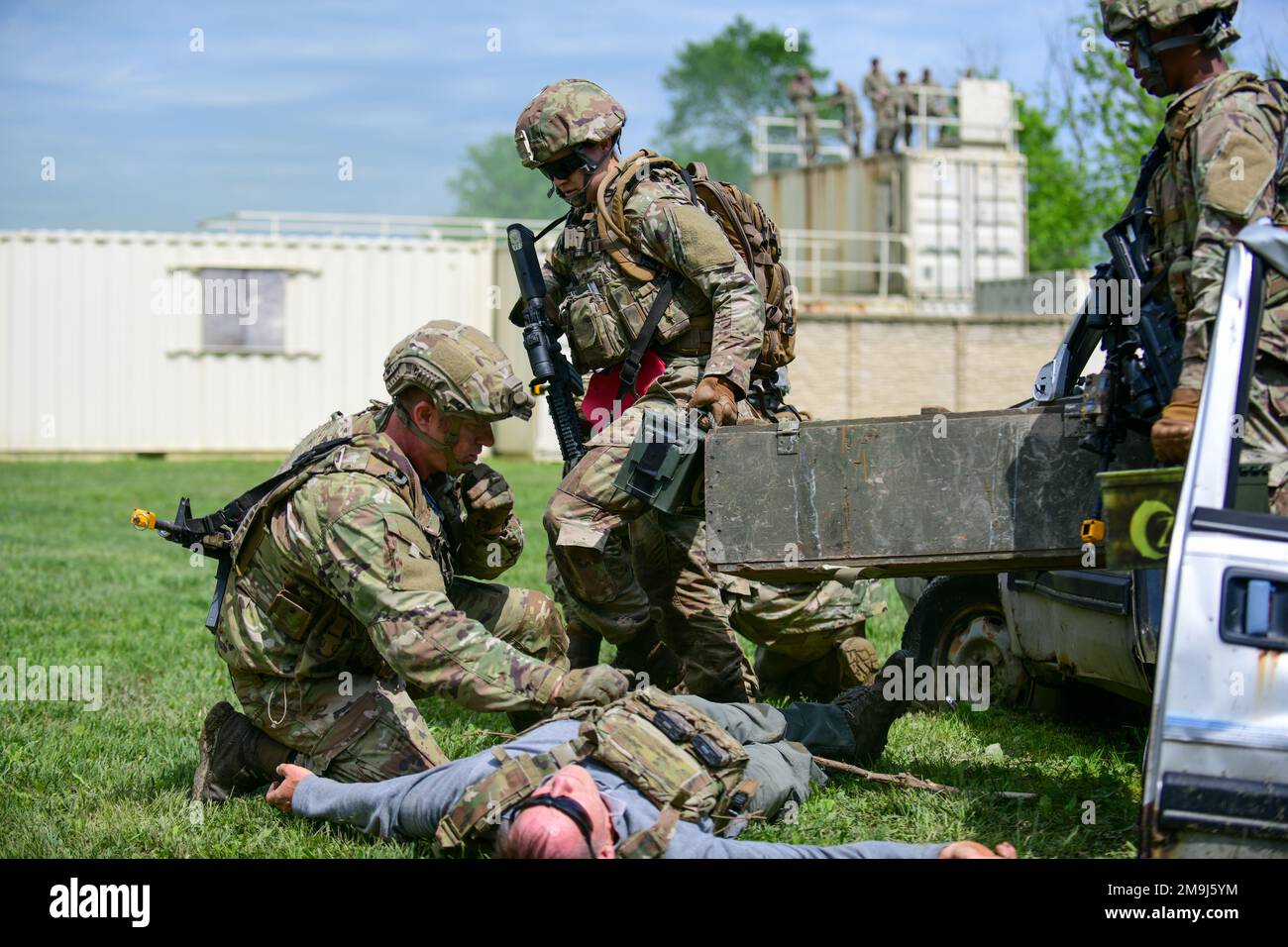 Tech. Sgt. Christopher Cabibi (front) searches an opposing force member ...