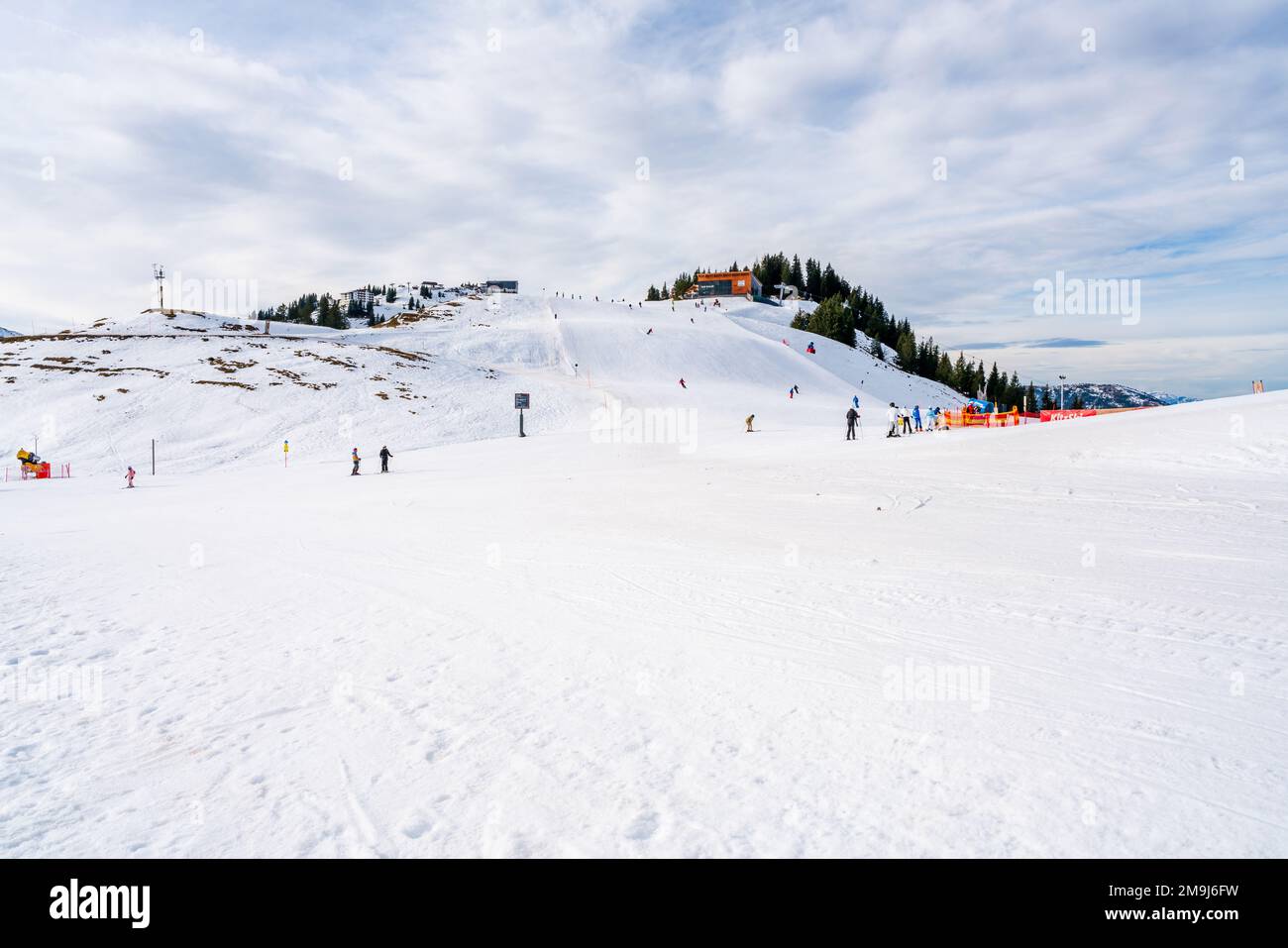 KITZBUHEL, AUSTRIA - JANUARY 08, 2023: Skiers enjoy winter sport on the ...