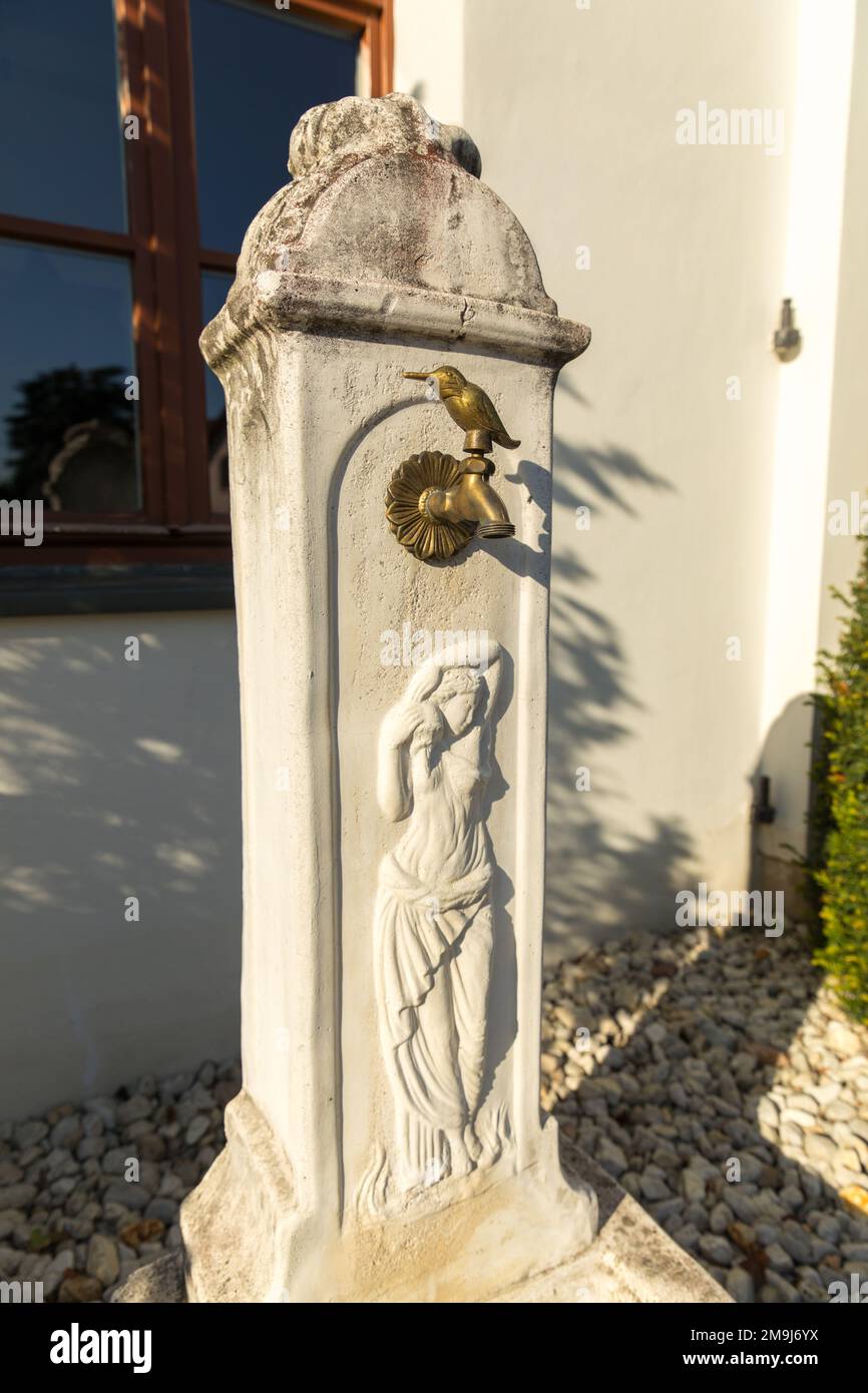 Artistic tap with water, tap in the shape of a golden bird Stock Photo ...