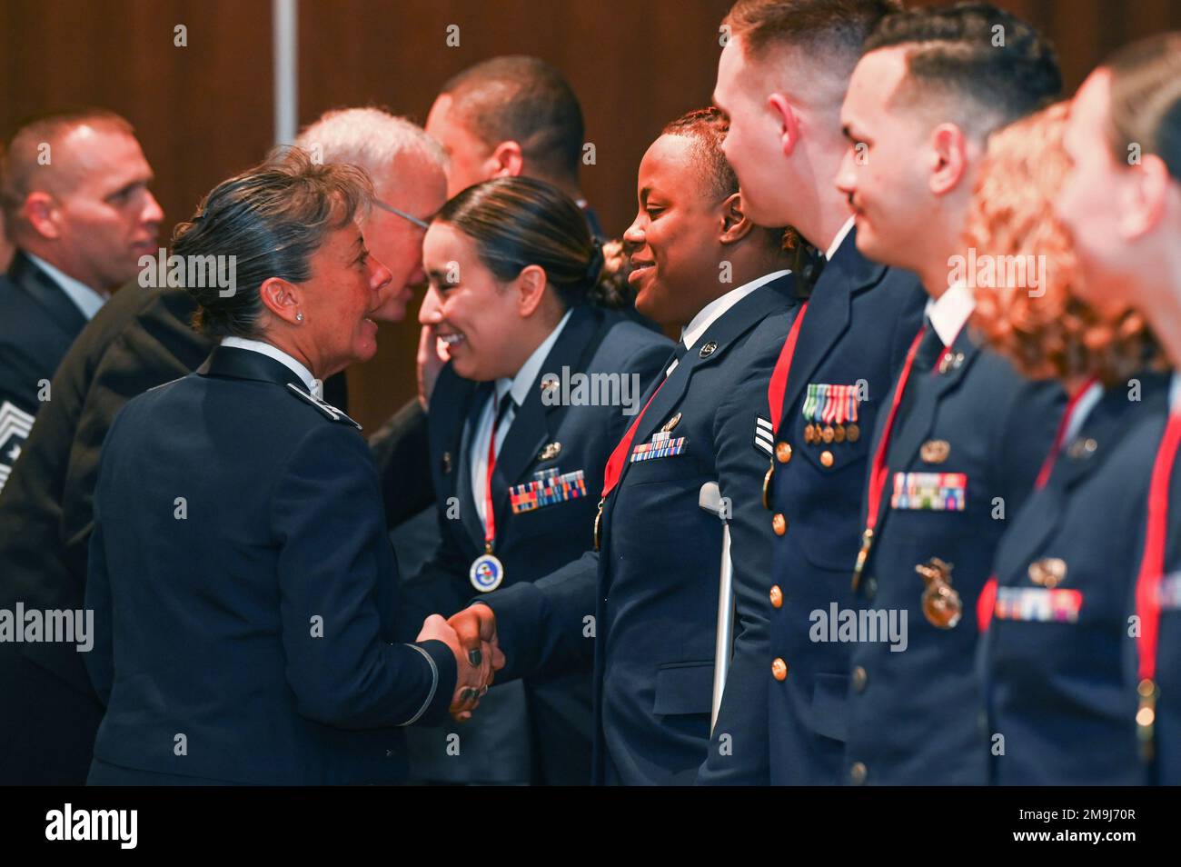 Col. Katrina Stephens, installation commander, shakes hands with Senior ...