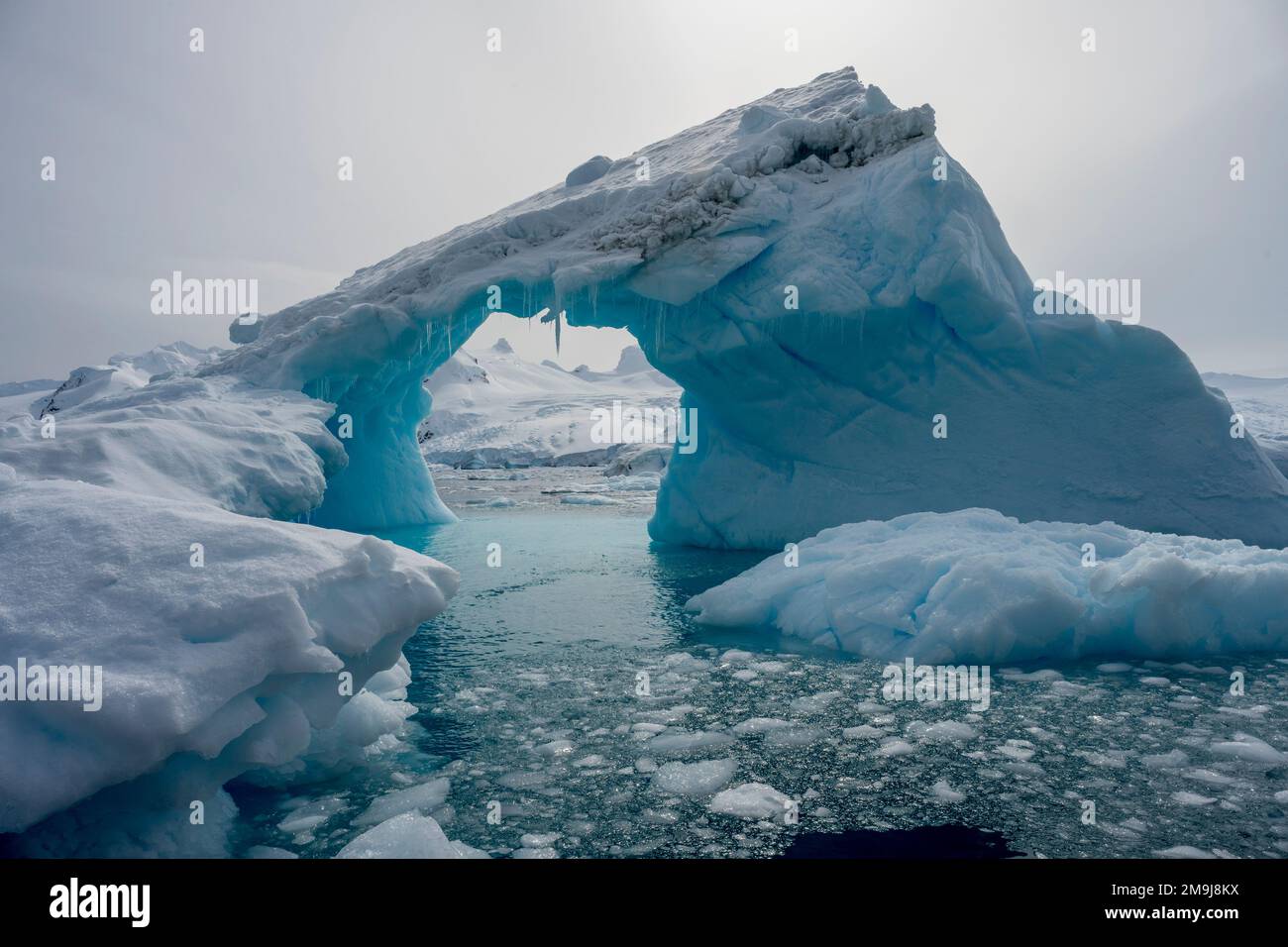 Iceberg with an arch in Cierva Cove, a cove along the west coast of ...
