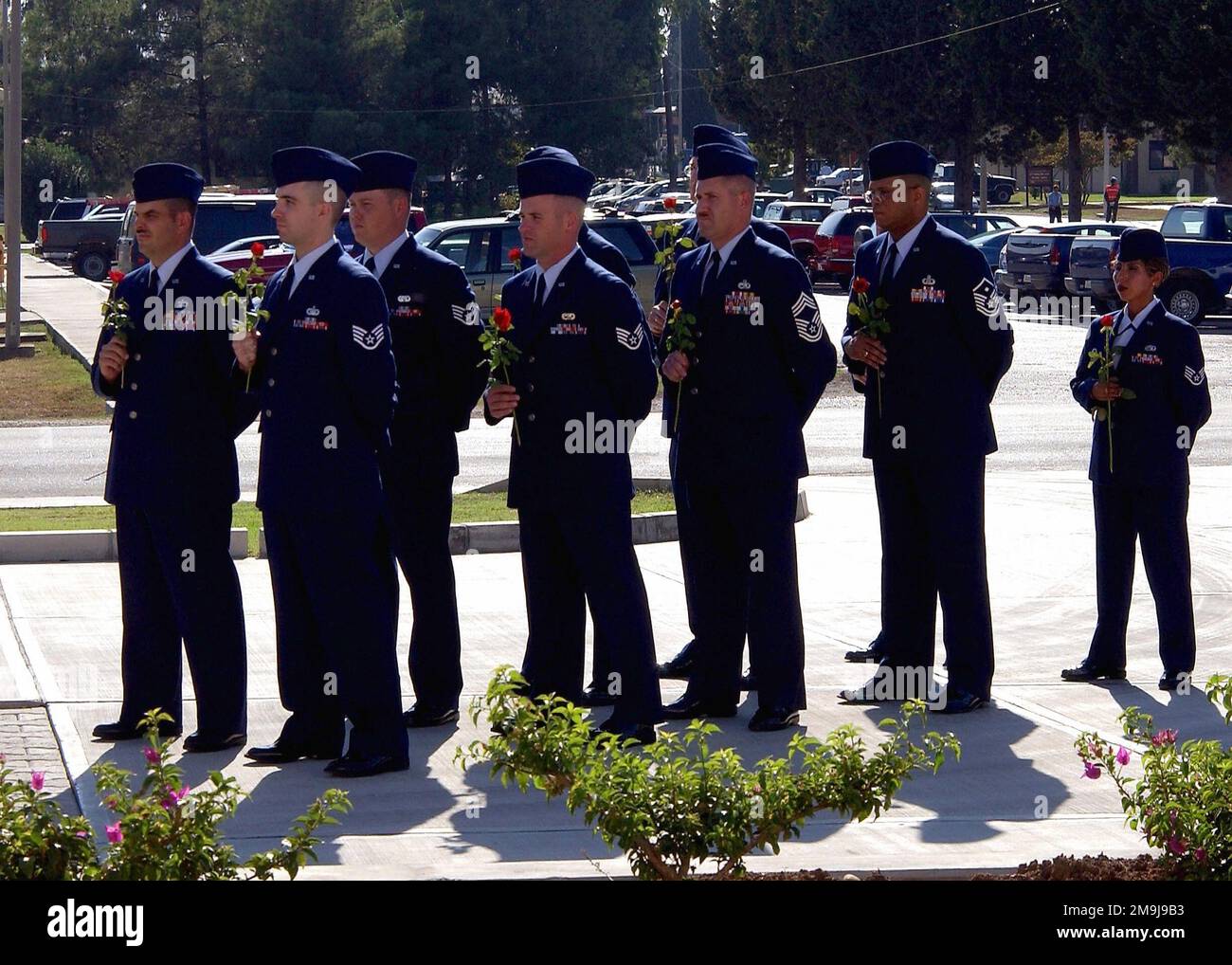 A US Air Force (USAF) honor flight prepares to lay memorial roses at a ...