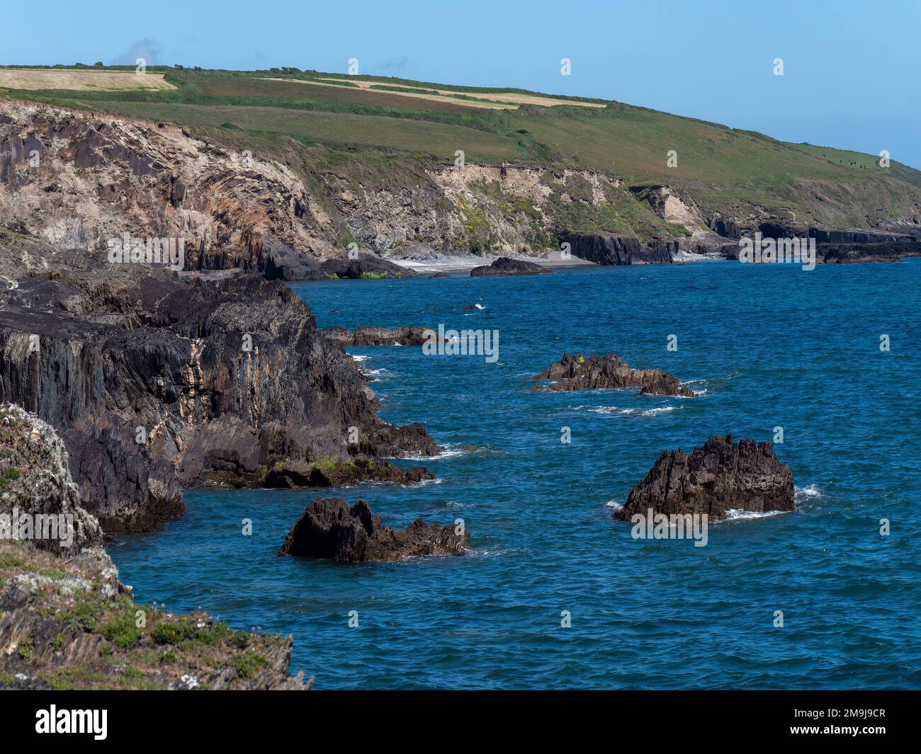 Irish sea landscape. Rocky coast of the Atlantic on a day. The blue sea ...