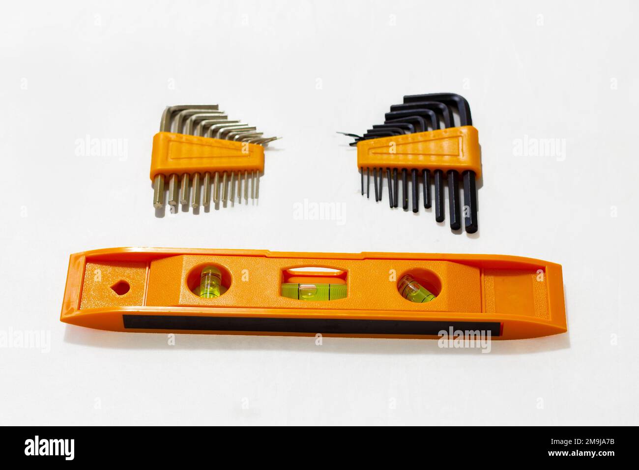 allen keys and level on white background Stock Photo - Alamy