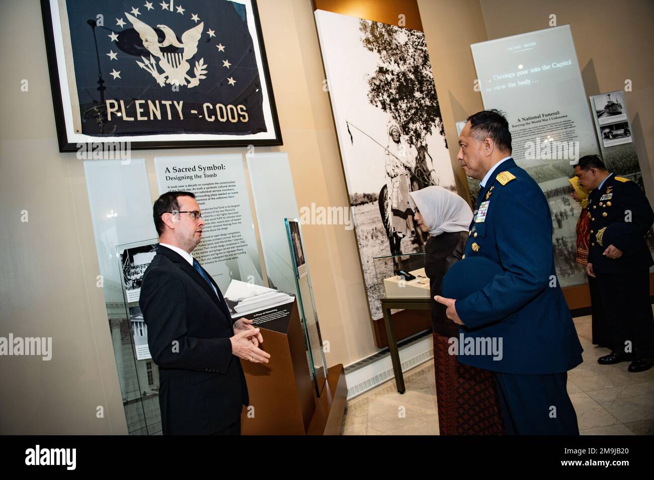 Tim Frank (left), historian, Arlington National Cemetery, gives a tour ...