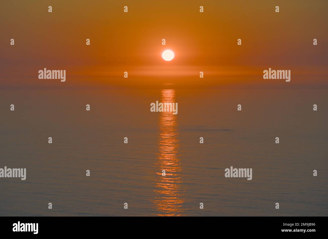 Sunset and the reflection of the red sunshine in the the middle of the ...