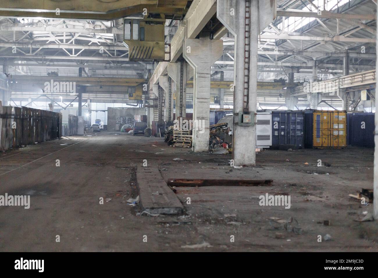 An old, empty, historic warehouse with lots of windows and sunshine ...