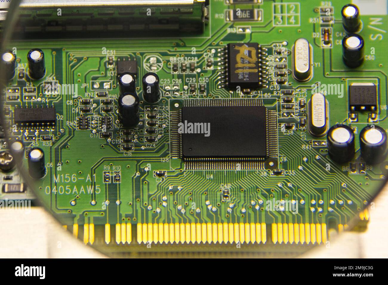 Microchippanel, the board is viewed under a magnifying glass Stock ...