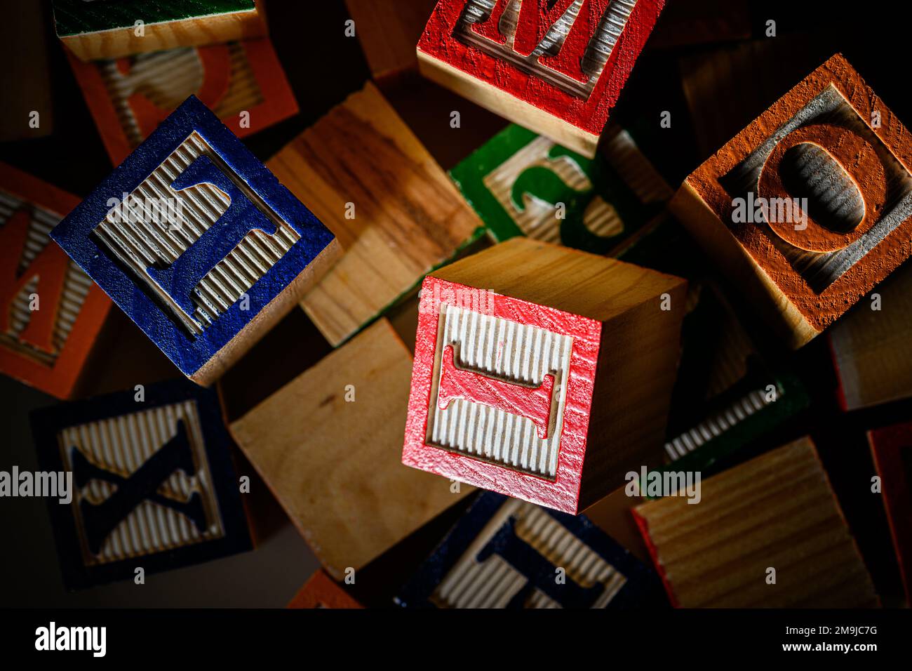 A colorful group of children's, wooden letter blocks Stock Photo - Alamy