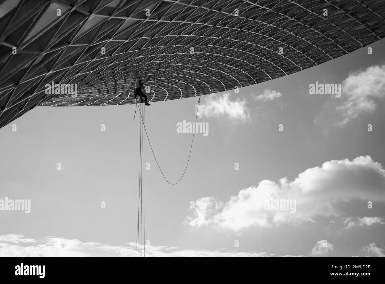 A Greyscale of modern architecture with a diagrid roof structural ...