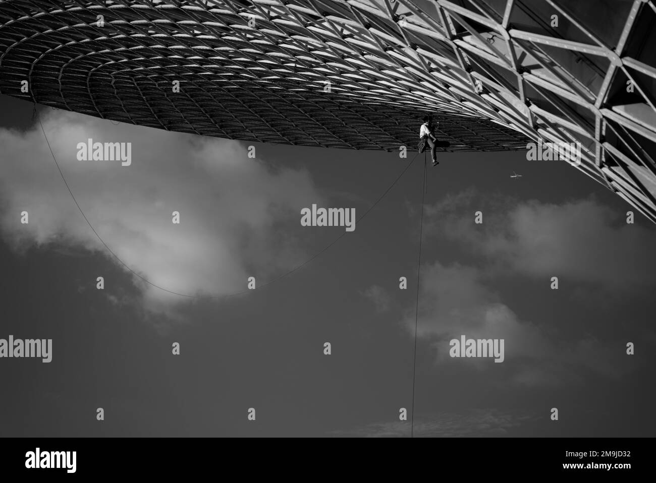 A Greyscale of modern architecture with a diagrid roof structural ...