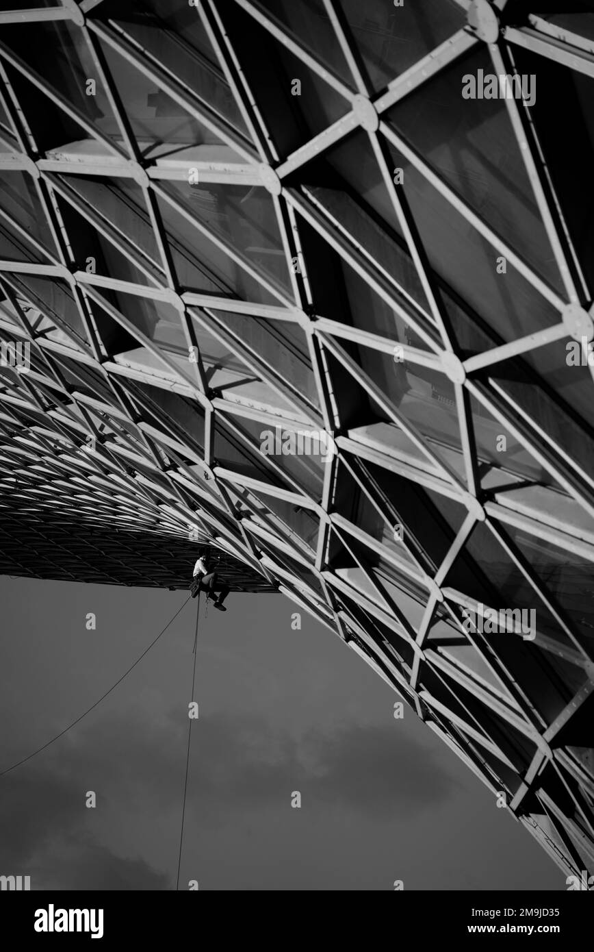 A Greyscale of modern architecture with a diagrid roof structural ...