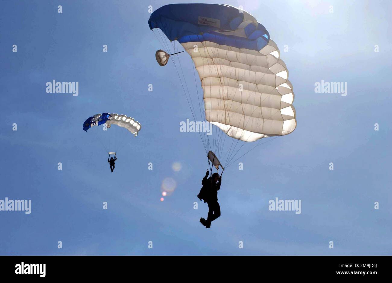 Members of the US Air Force Academys Wings of Blue parachute team ...