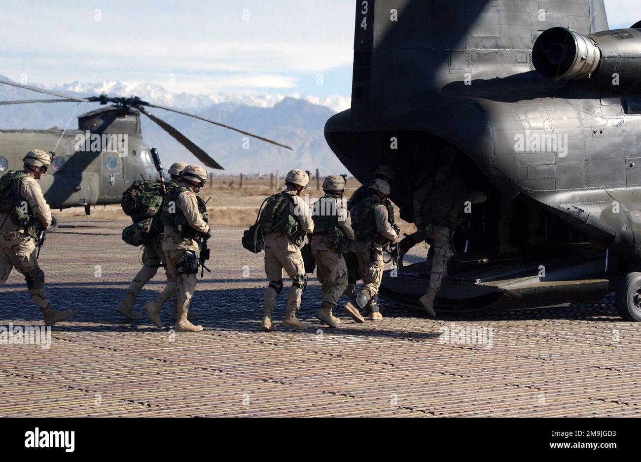 A CH-47 Chinook helicopter is boarded by soldiers assigned to "C" Company, 2nd Battalion, 504th ...