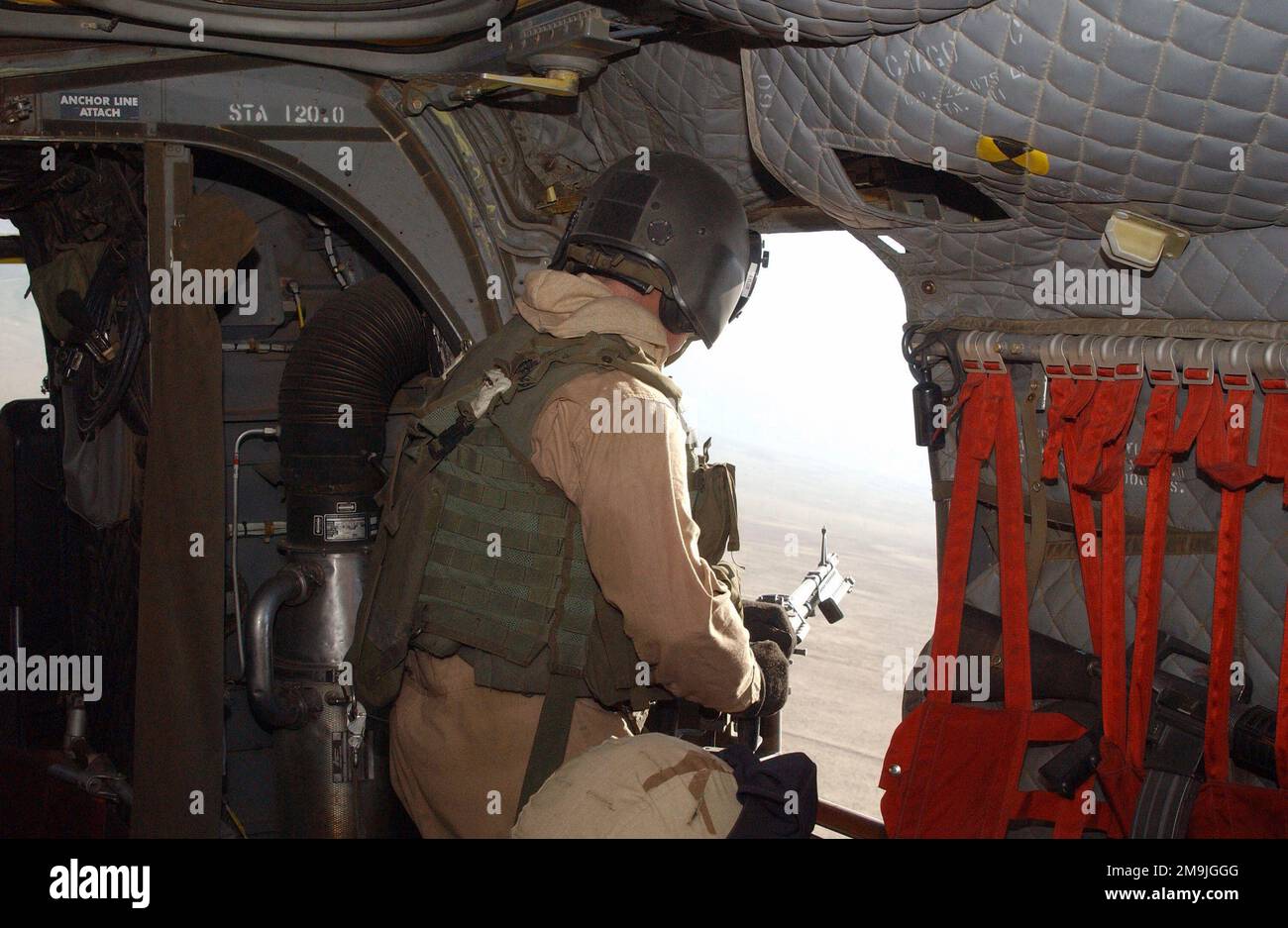 An 82nd Airborne Division soldier mans a 7.62mm M60 machine gun mounted ...