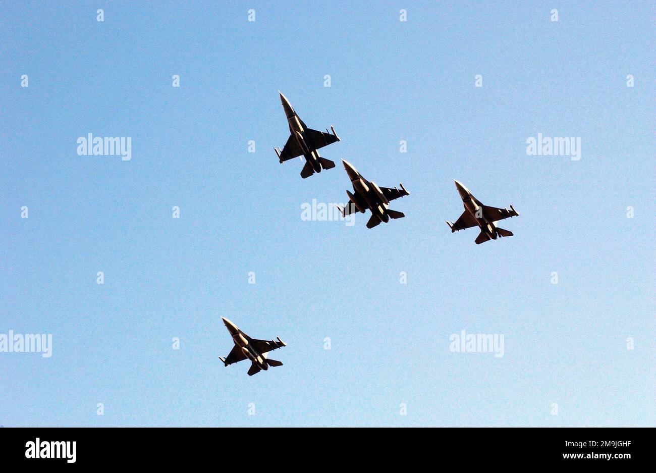 A missing man formation of F-16 Fighting Falcon aircraft fly over the ...