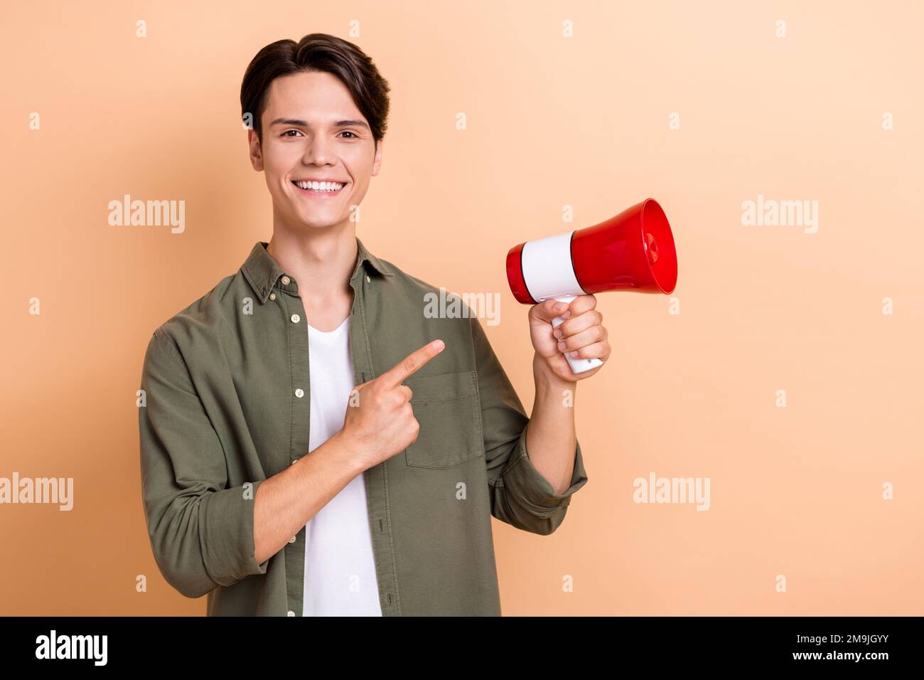 Cheerful positive man with loudspeaker hi-res stock photography and ...