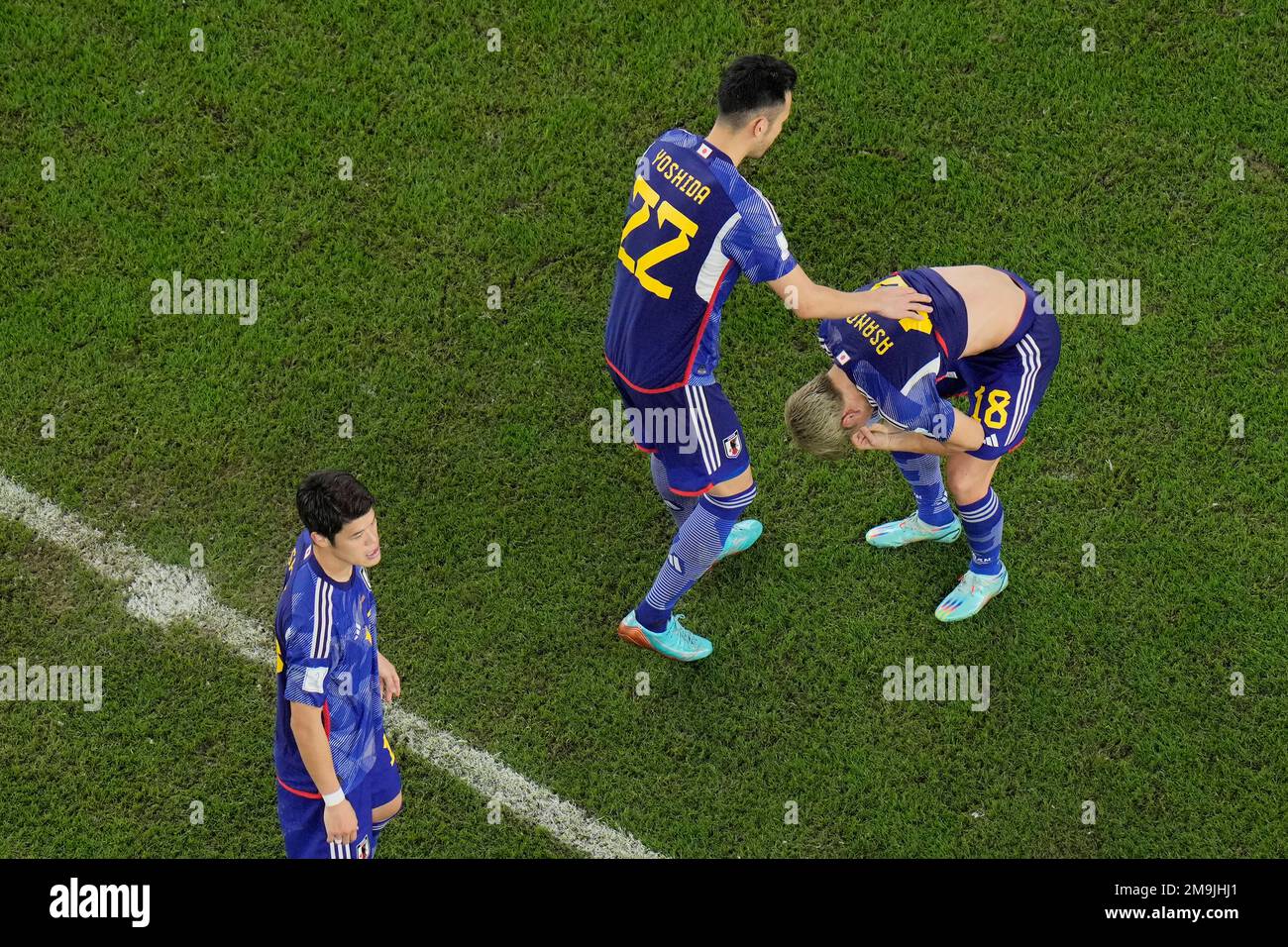Japan's players react at the end of the World Cup round of 16 soccer ...