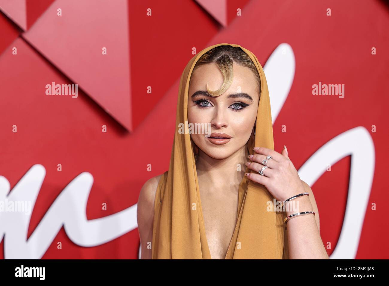 Sabrina Carpenter poses for photographers upon arrival at the British ...