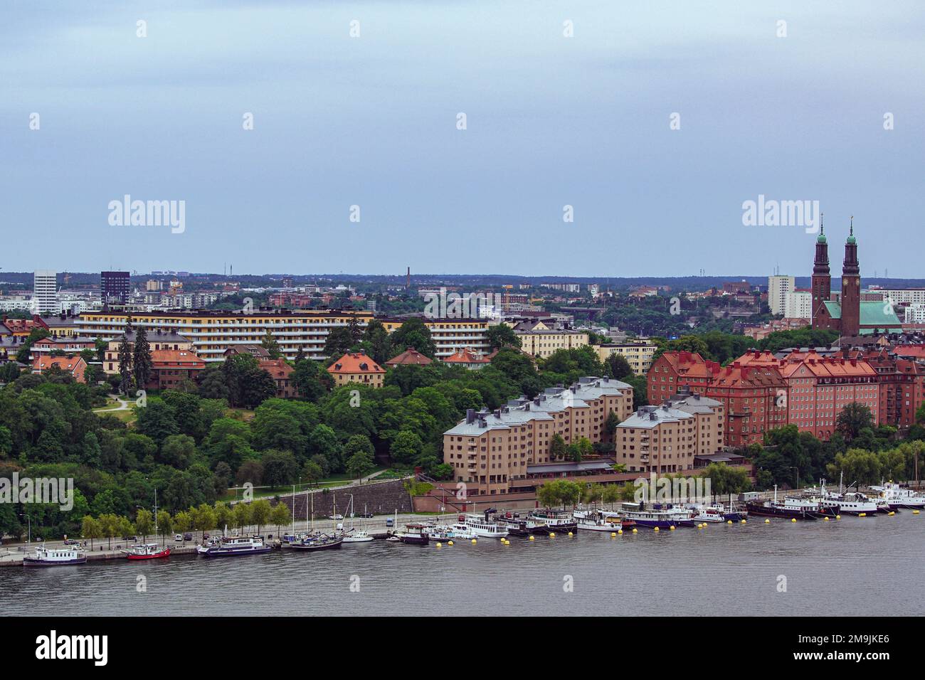 High angle view of buildings by river against sky Stock Photo - Alamy