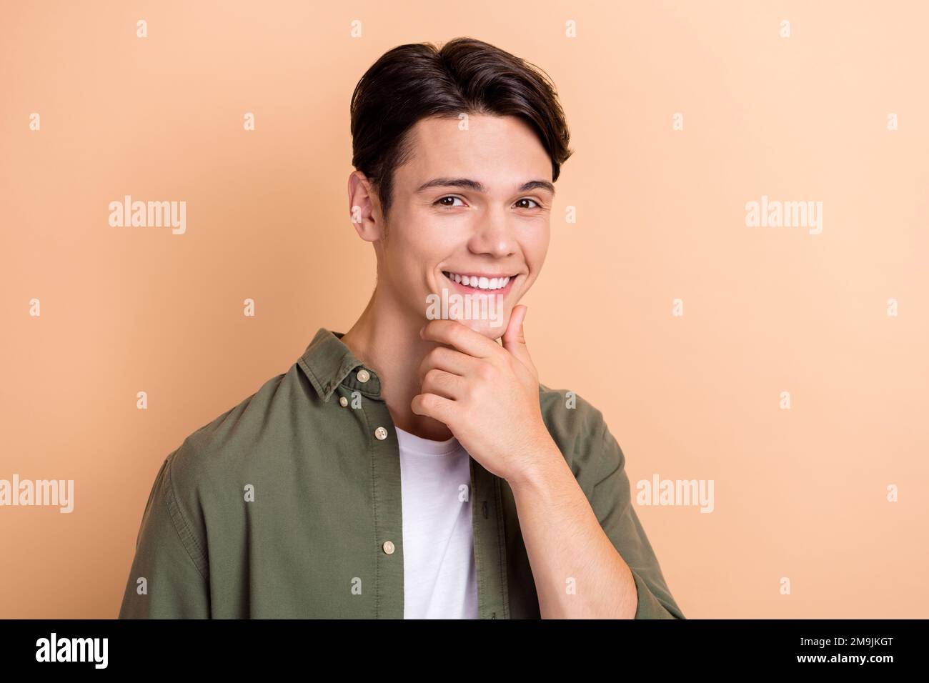 Photo of positive cheerful clever person hand touch chin beaming smile ...