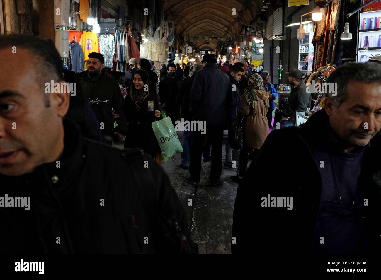 People walk through Tehran's main old bazaar, Iran, Monday, Dec. 5 ...
